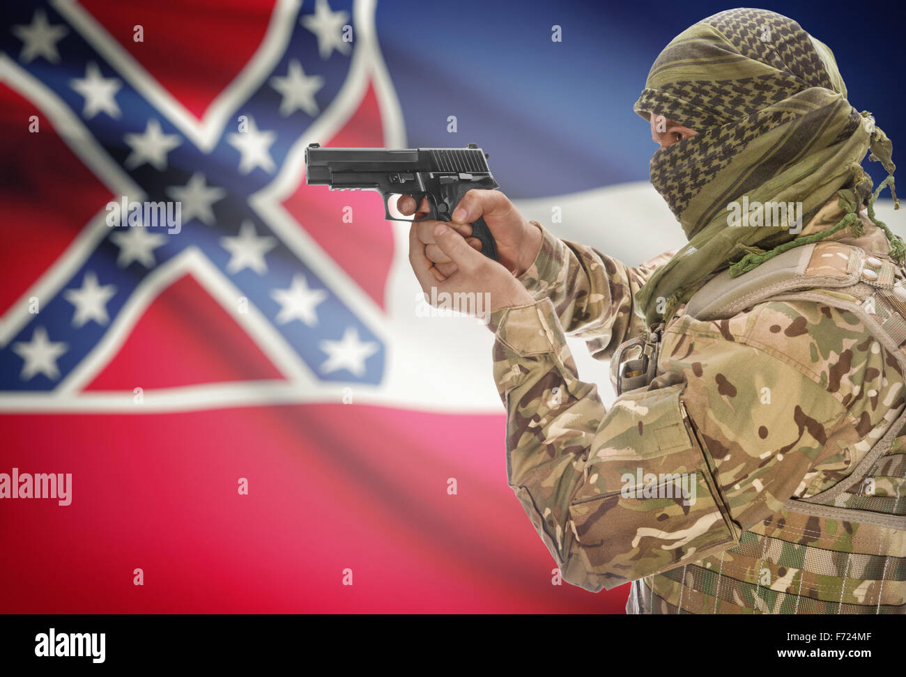 Male in muslim keffiyeh with gun in hand and flag on background series ...