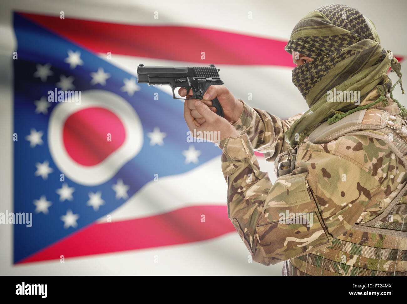Male in muslim keffiyeh with gun in hand and flag on background series ...