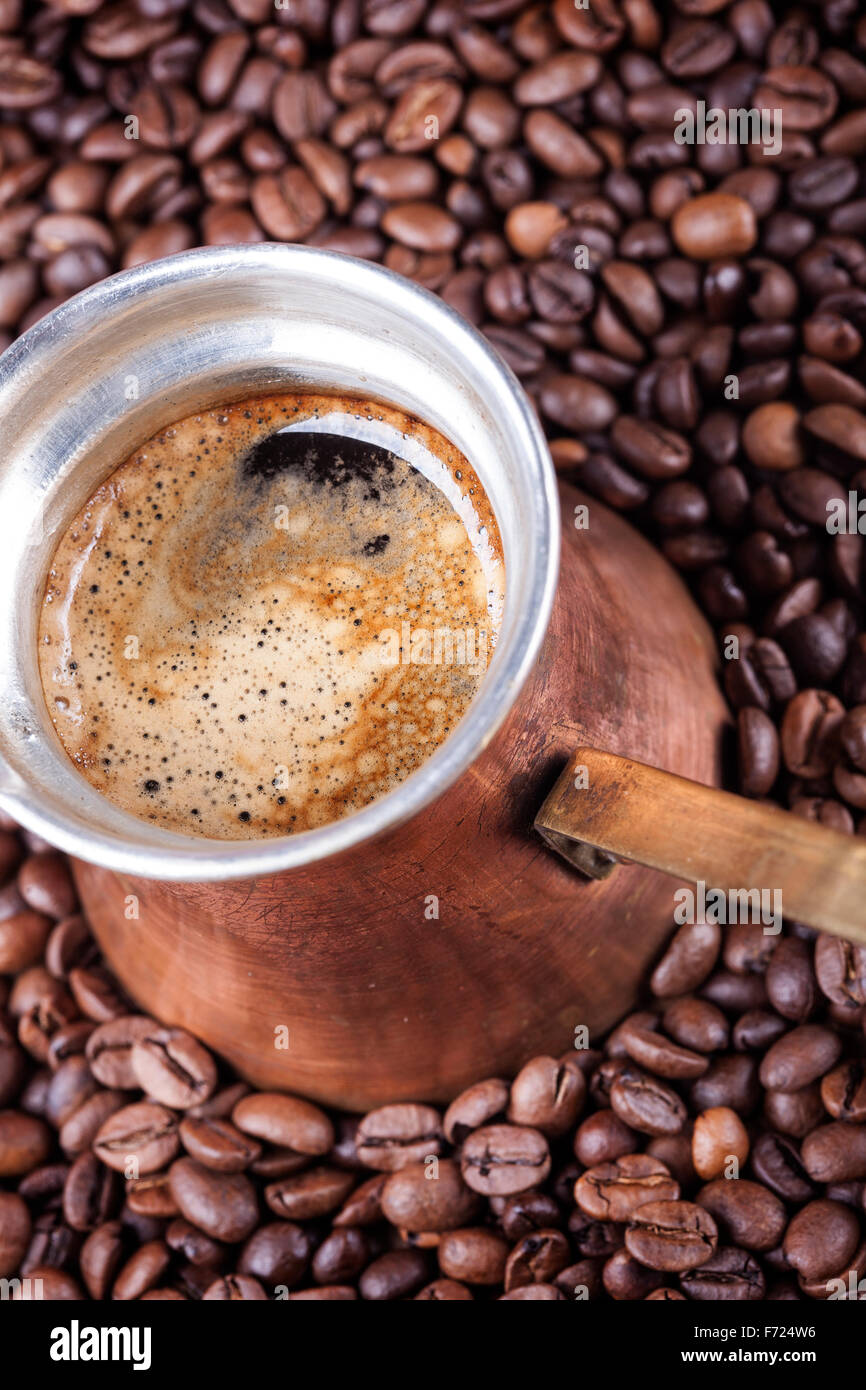 Coffee beans, vintage copper coffee pot closeup, cezve or ibrik Stock ...