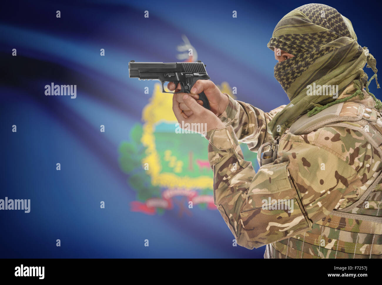 Male in muslim keffiyeh with gun in hand and flag on background series ...