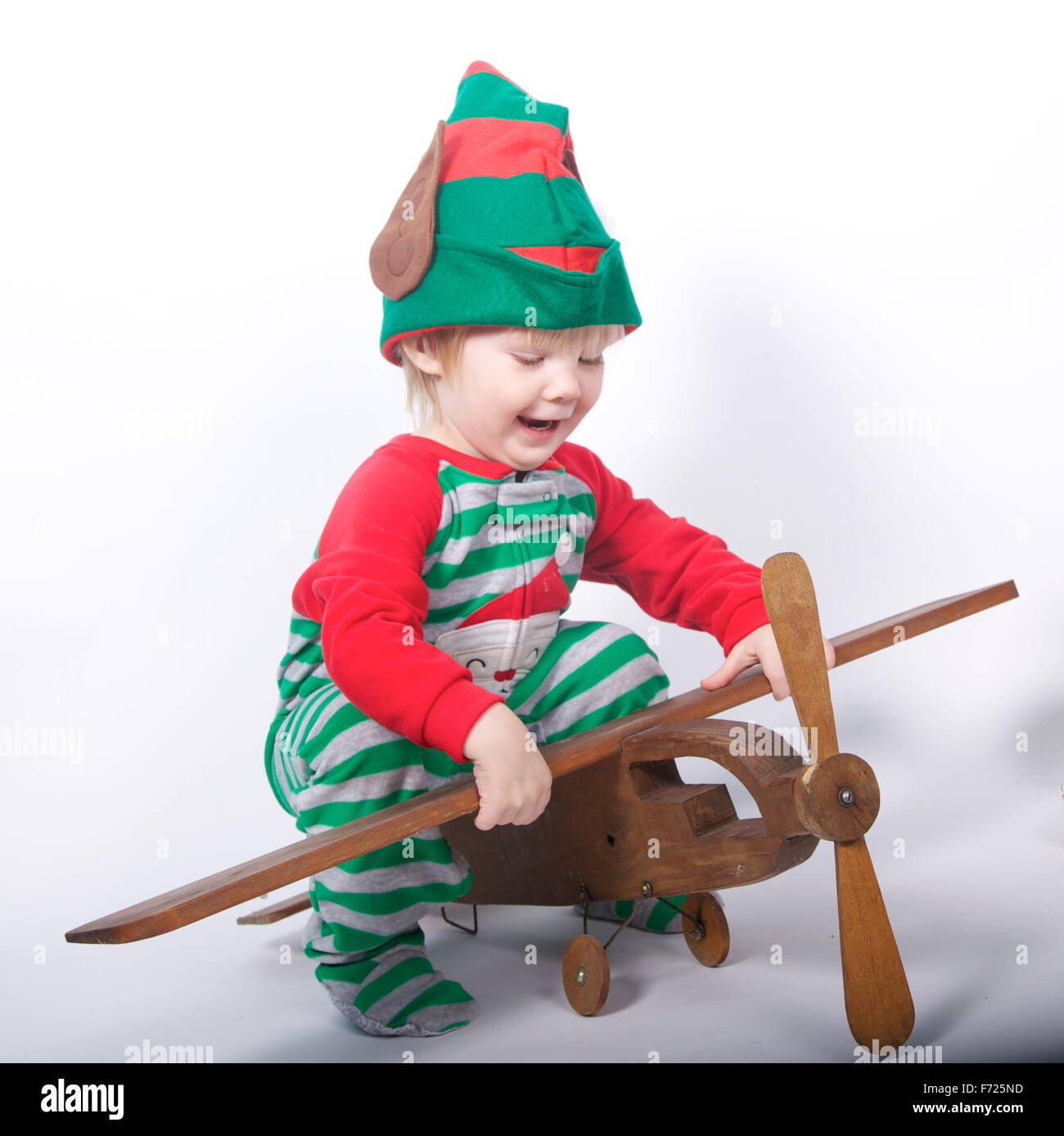 Boy dressed as Elf in toy workshop Stock Photo - Alamy