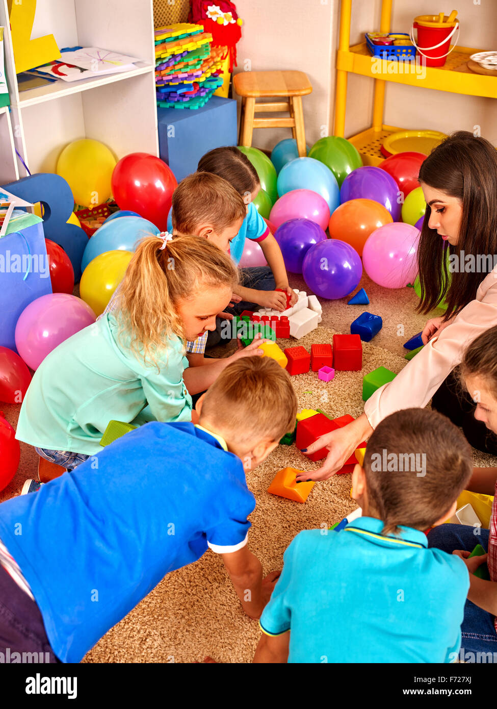 Group children game blocks on floor Stock Photo - Alamy