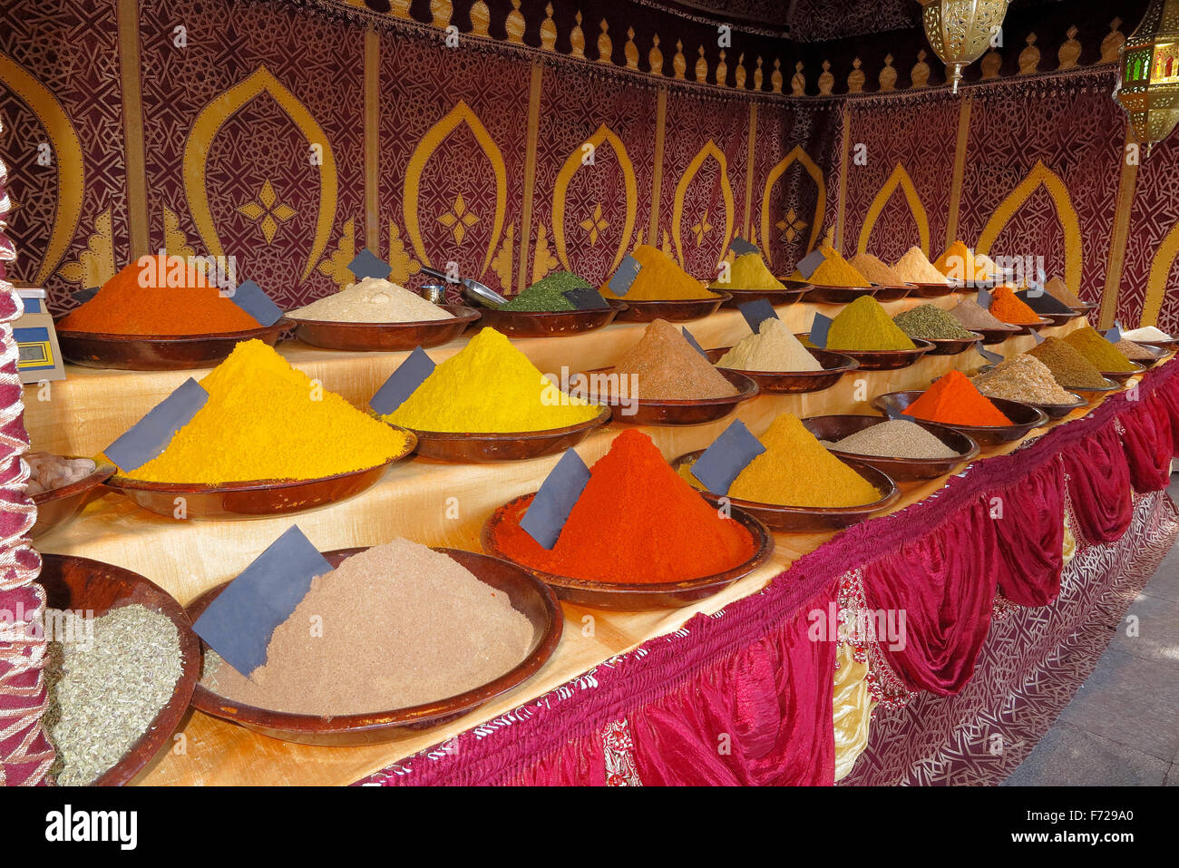 some dishes with different types of spices on a outdoor shop during the ...