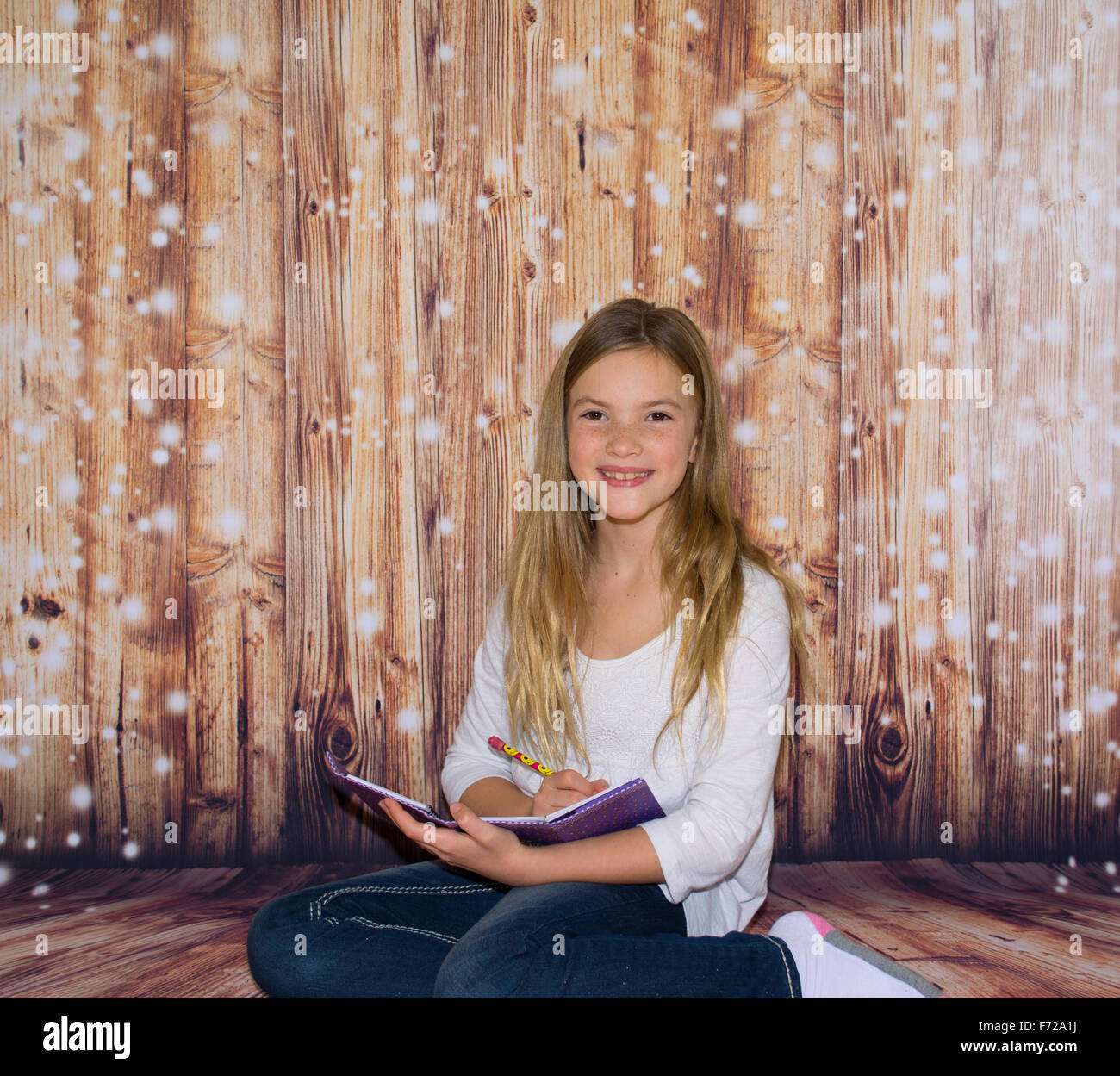 Cute girl writing Stock Photo - Alamy