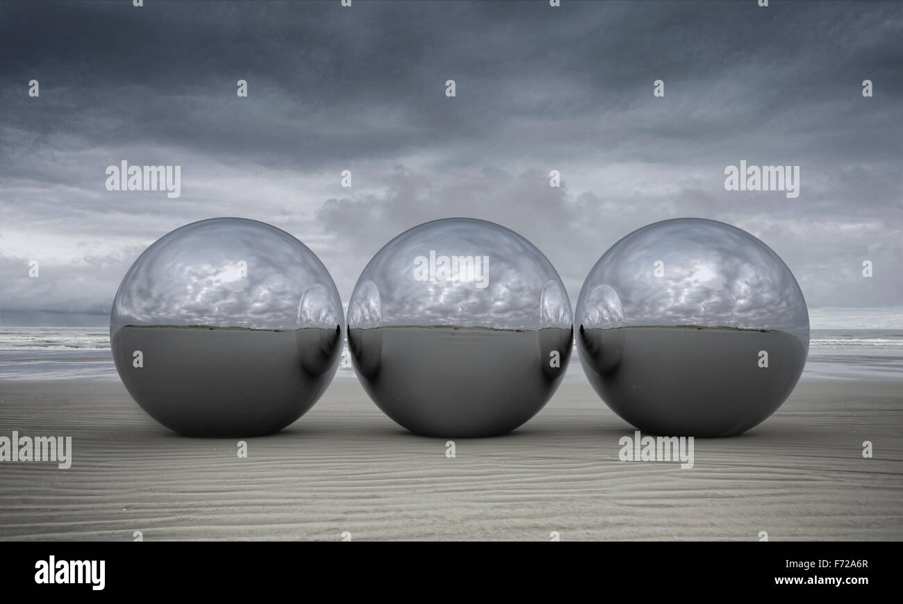 Three chrome (reflective) balls on the beach Stock Photo - Alamy