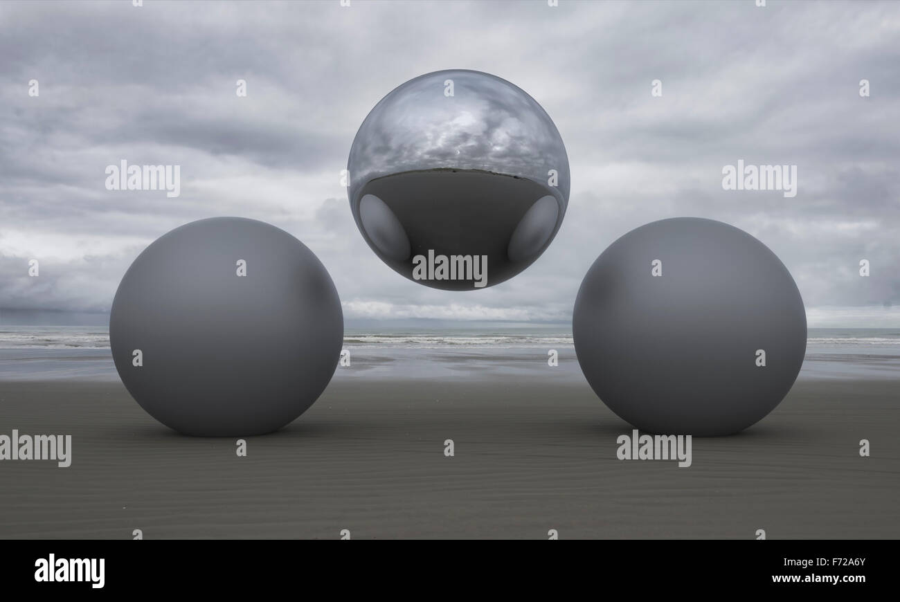 Three metal balls on the beach Stock Photo - Alamy