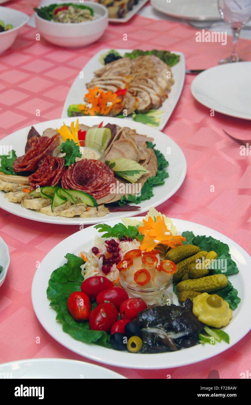 Assorted fresh salads displayed on a buffet in individual containers at ...