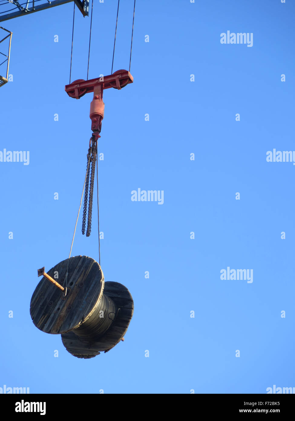 Cable drum hoisted on crane to prevent theft Stock Photo - Alamy