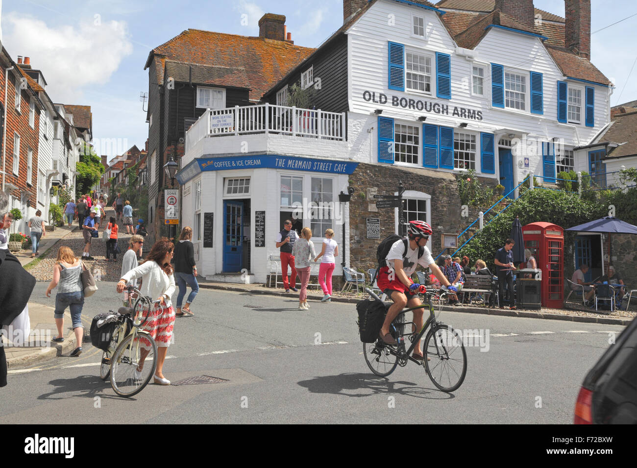 Bikes and pedestrians on Mermaid Street, Rye, East Sussex, UK Stock ...