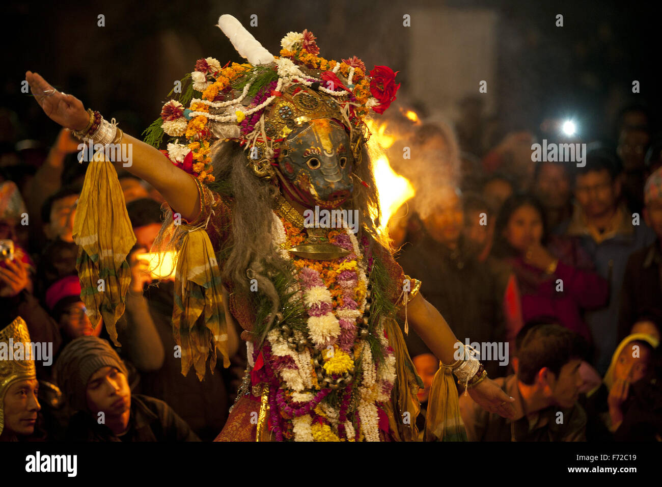 Lalitpur, Nepal. 23rd Nov, 2015. An artist in traditional costume and a ...