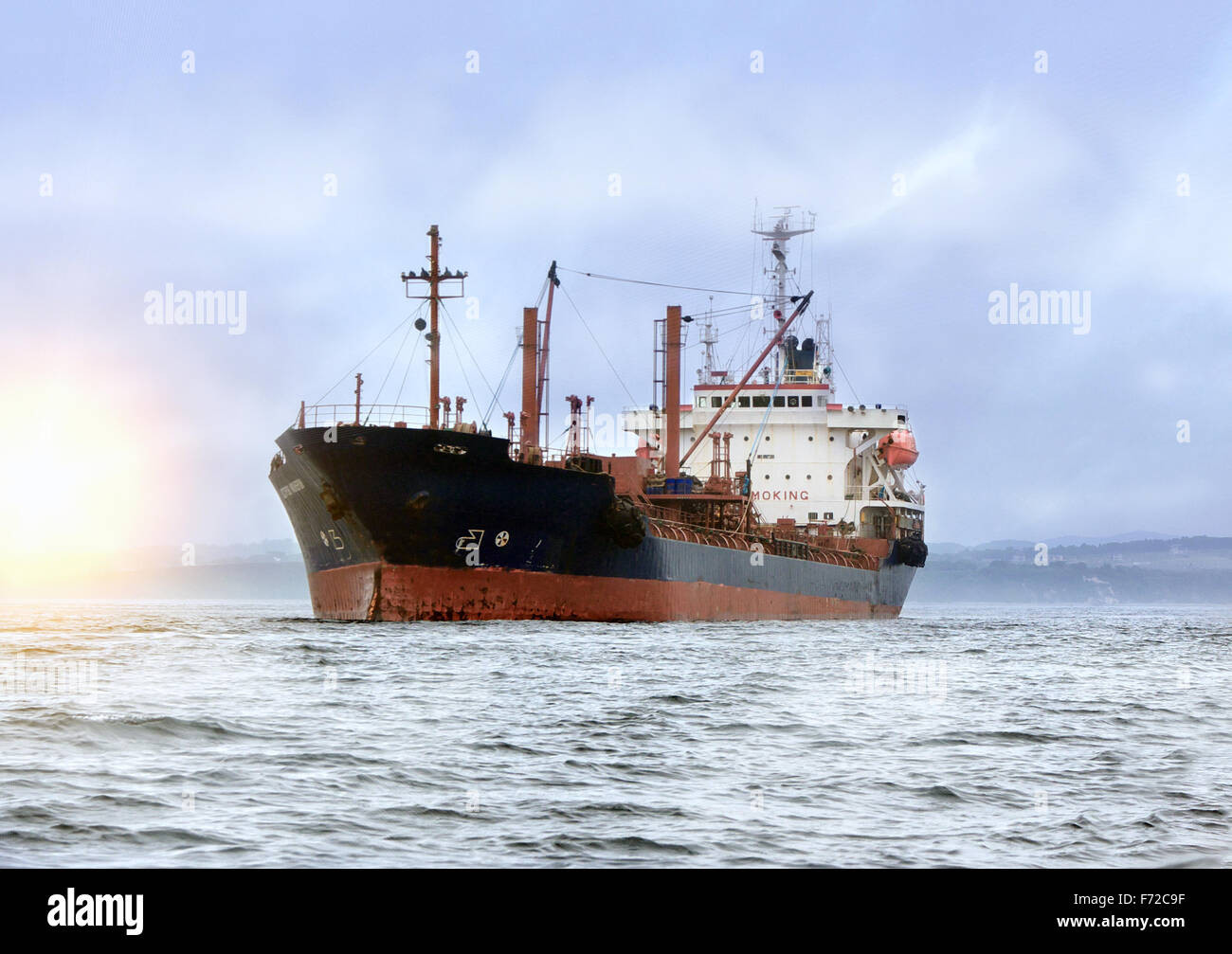 large cargo ship at sea background of blue sky in the calm Stock Photo ...