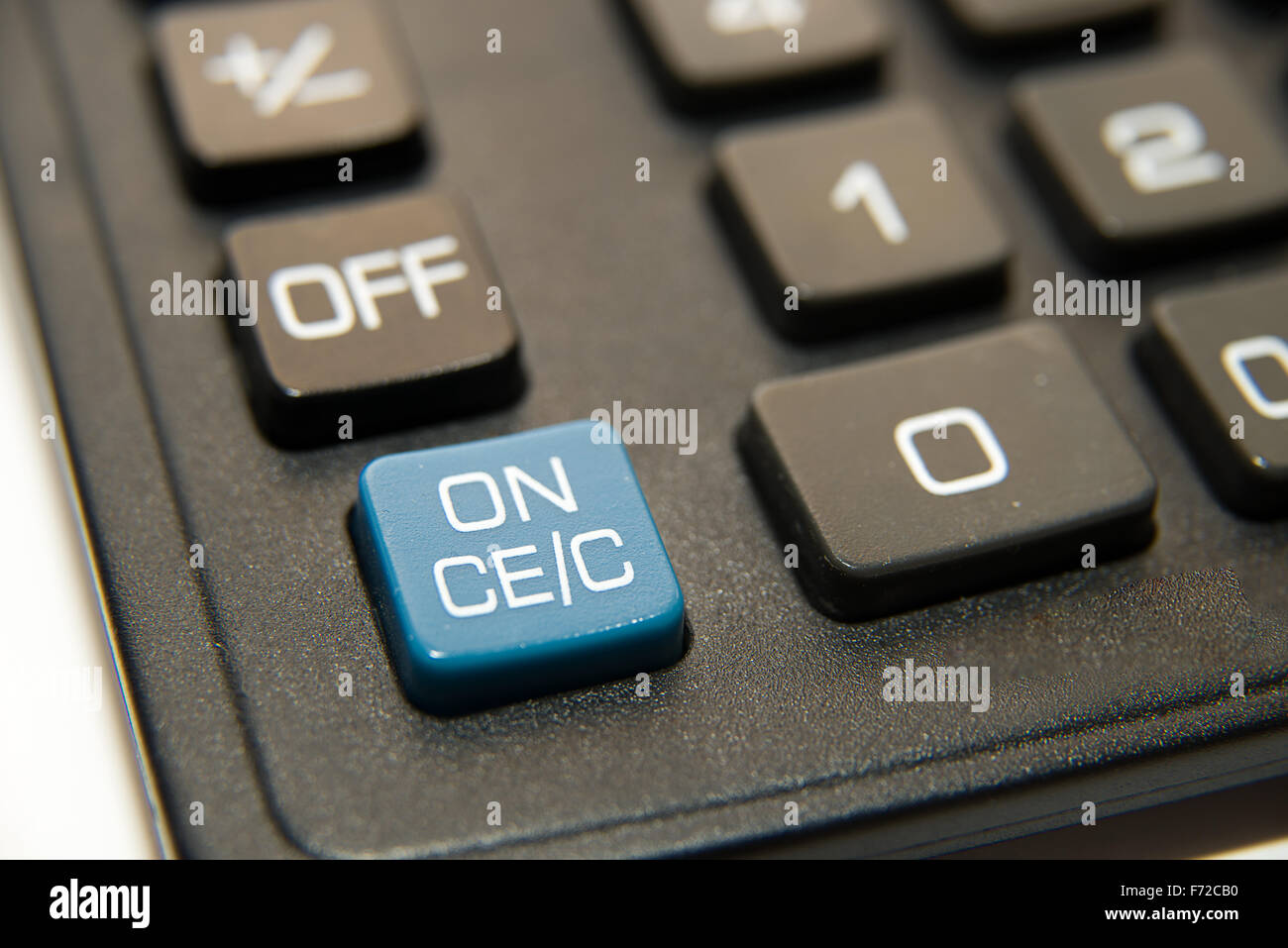 Blue button device for computing close-up Stock Photo - Alamy
