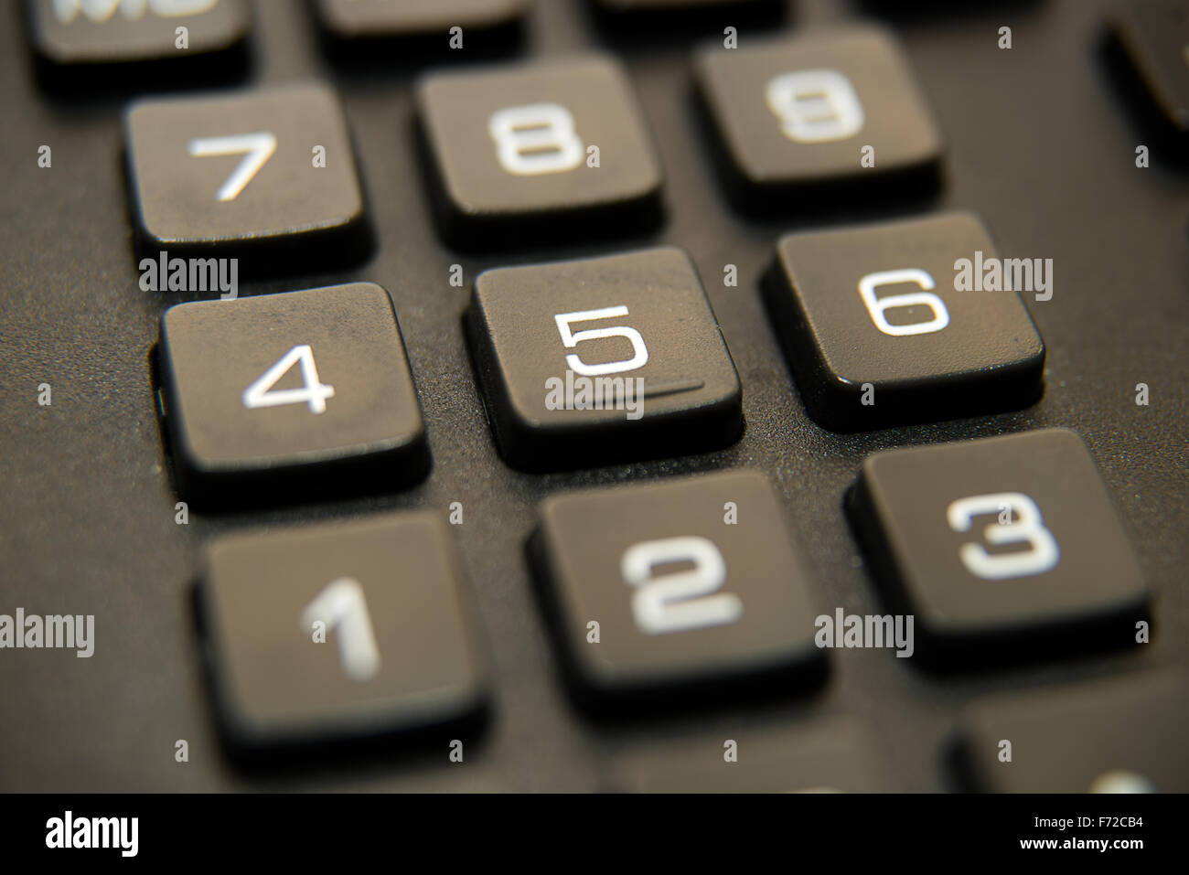 Black button device for computing close-up Stock Photo - Alamy