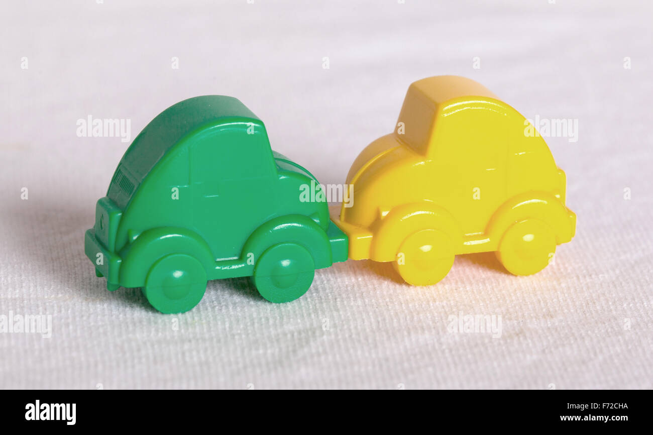Toy cars in a row isolated on white background, accident Stock Photo ...
