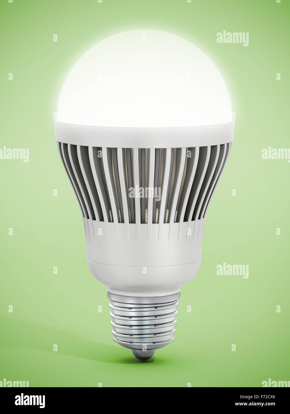 Energy saving LED lightbulb on green background Stock Photo - Alamy