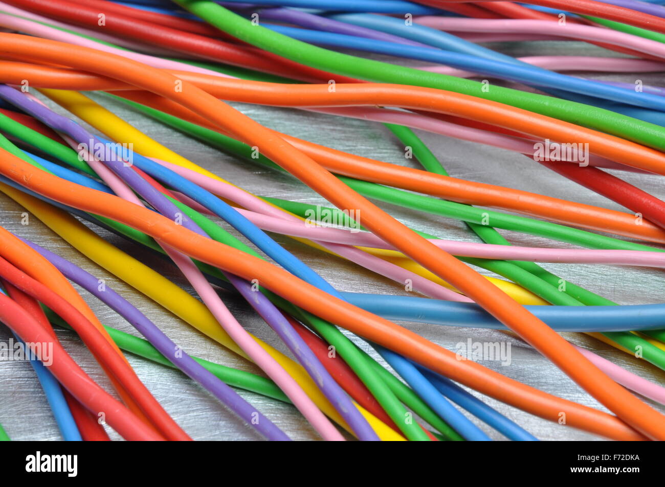 Colored electrical cables on metal surface Stock Photo - Alamy