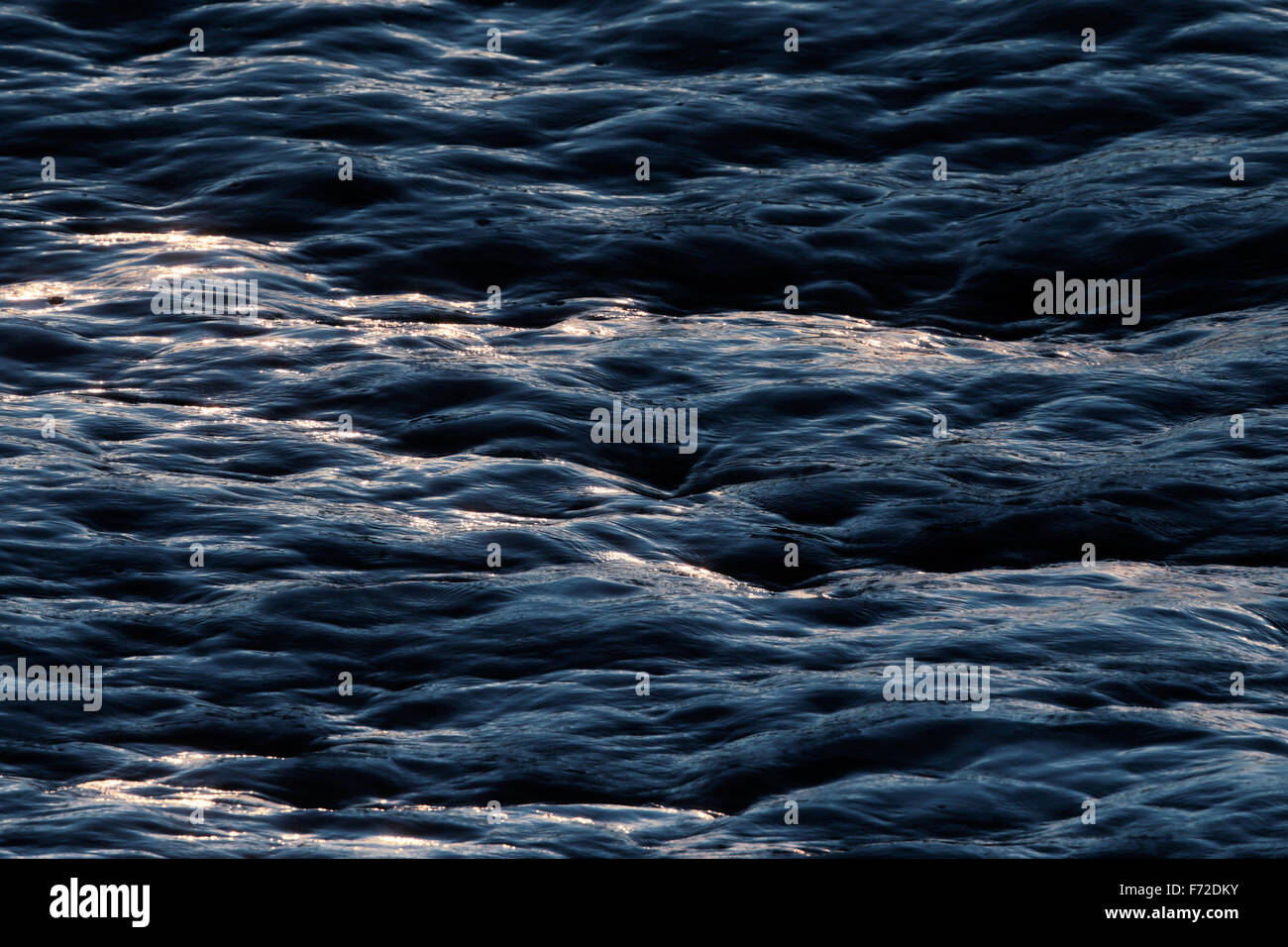 Water flowing on a river texture background Stock Photo - Alamy
