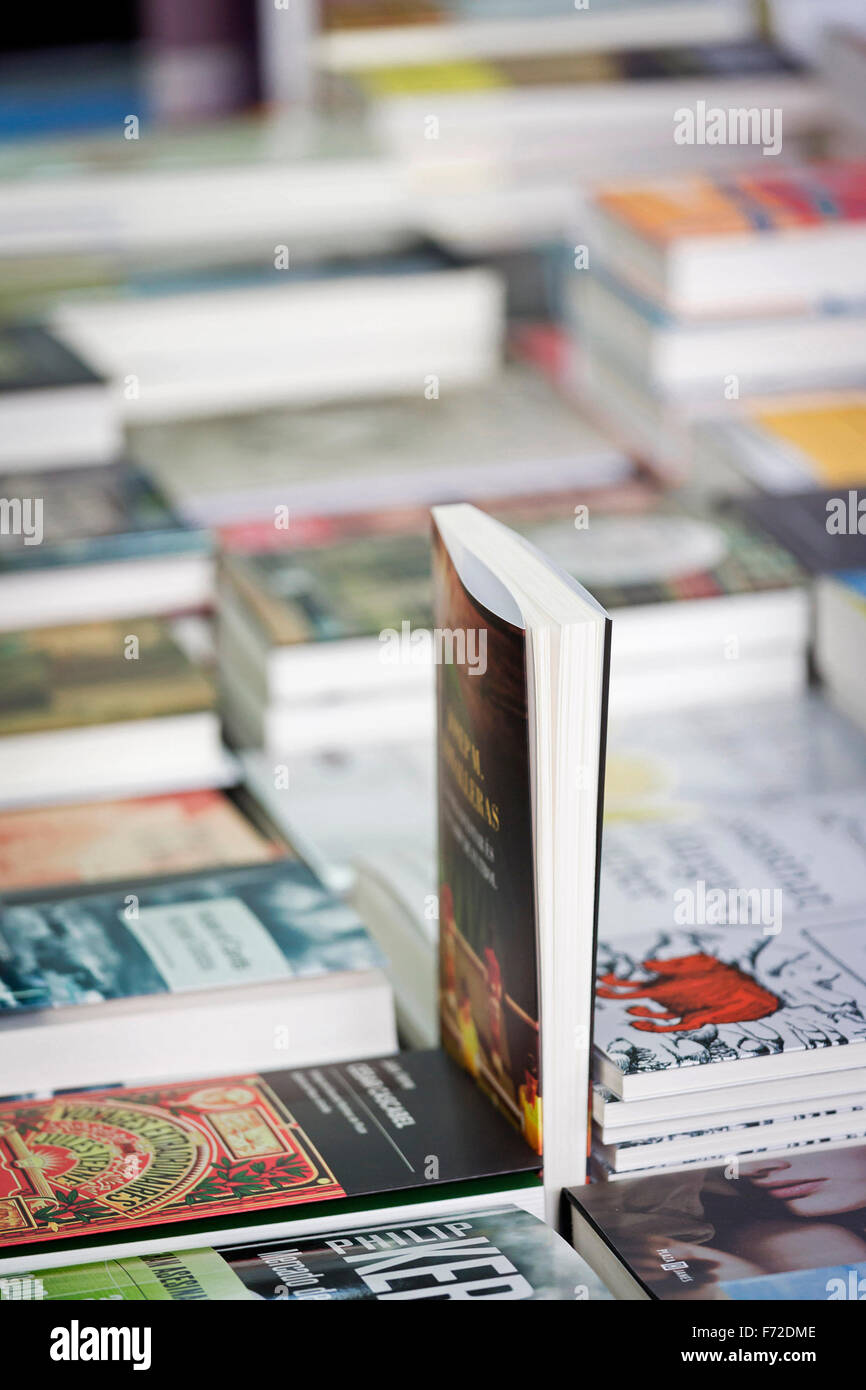 Books stored on a street seller stand during a local outdoors book fair ...