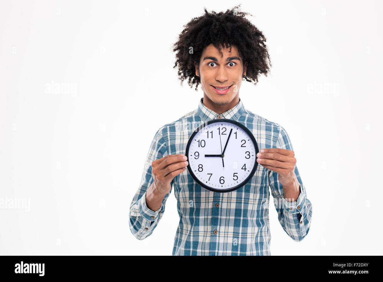 Handsome guy holding wall clock hi-res stock photography and images - Alamy