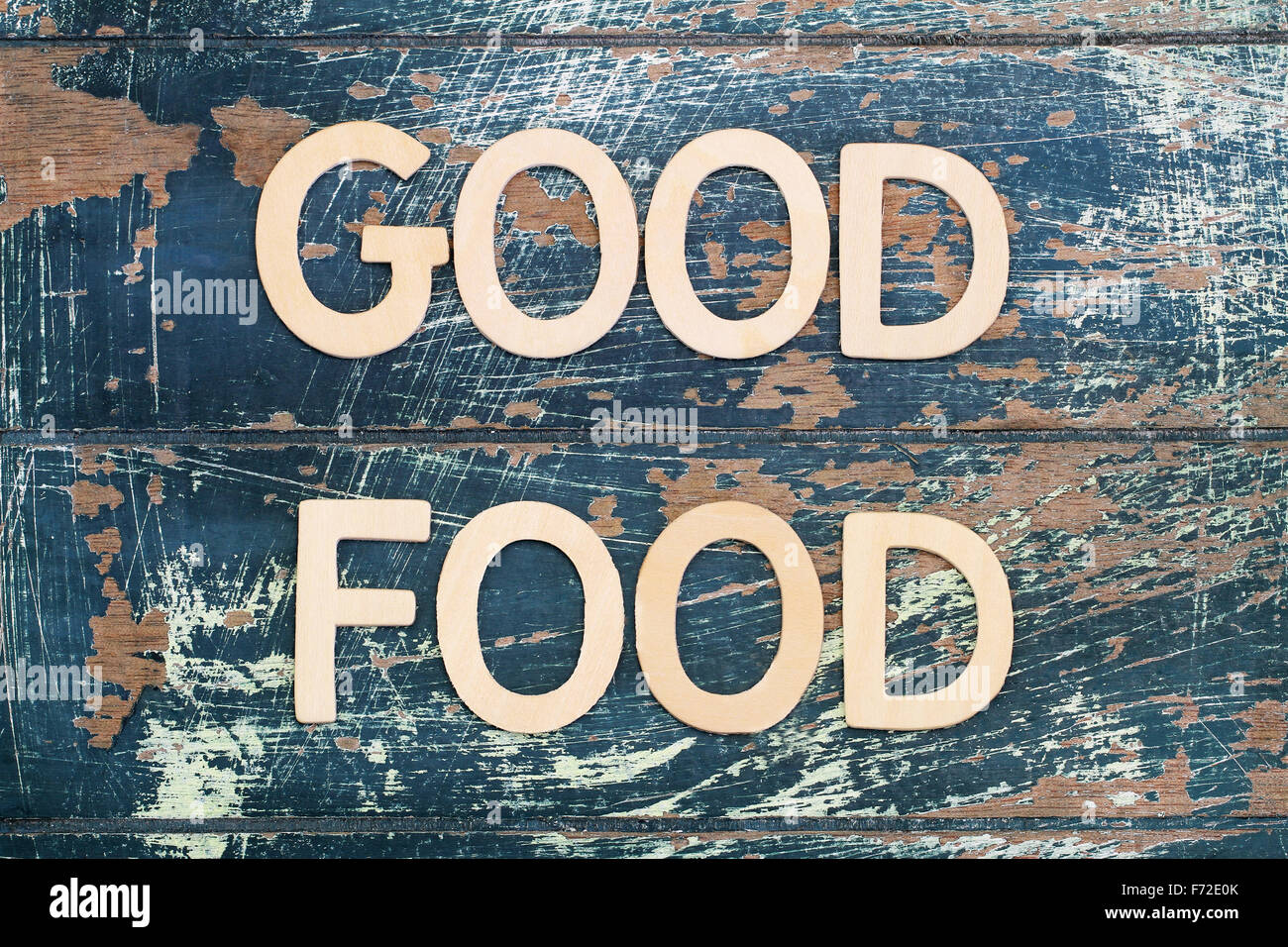 Good food written with wooden letters on rustic surface Stock Photo - Alamy