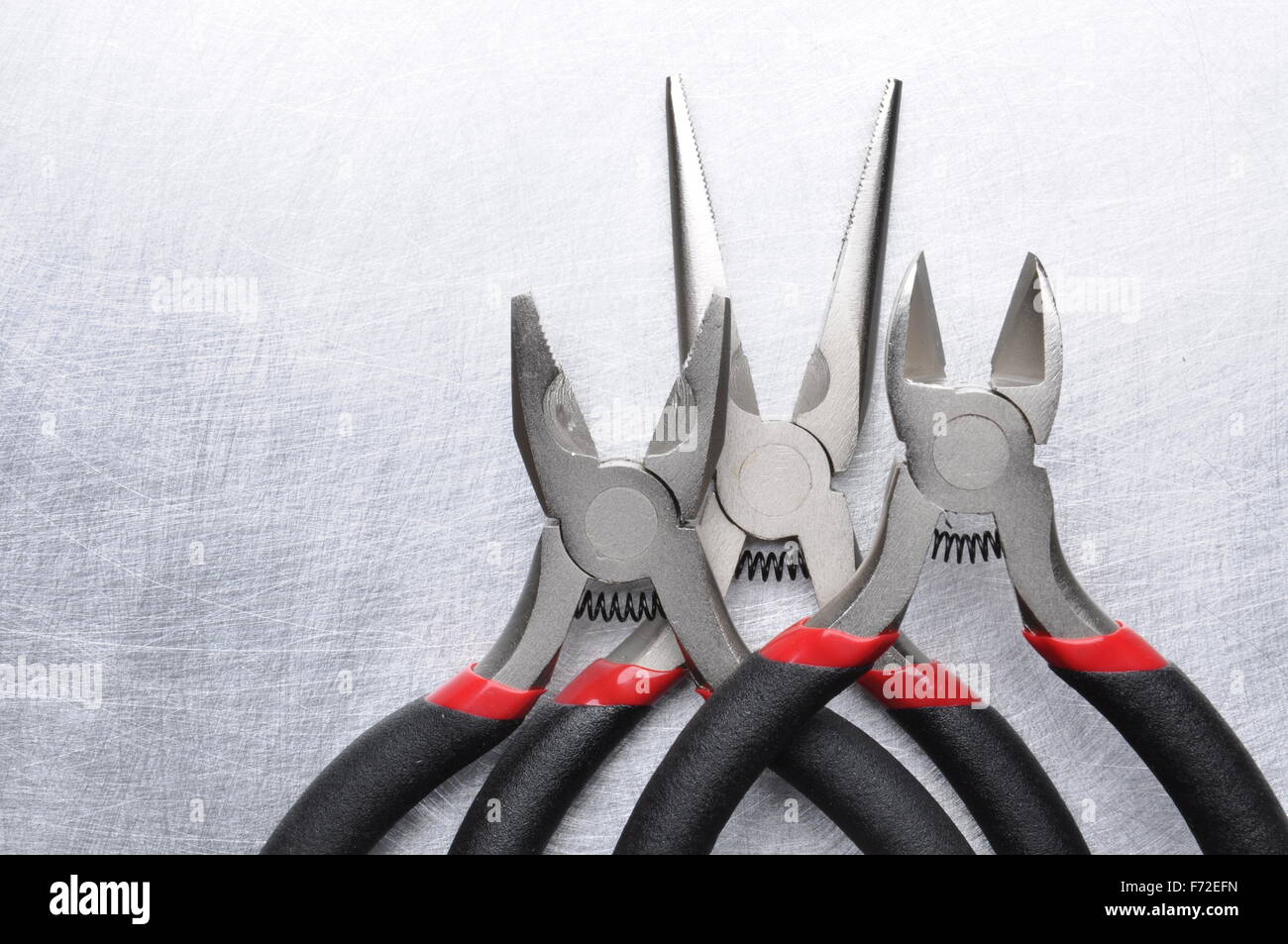 Electrical tools wire cutter, pliers on metal gray surface Stock Photo ...