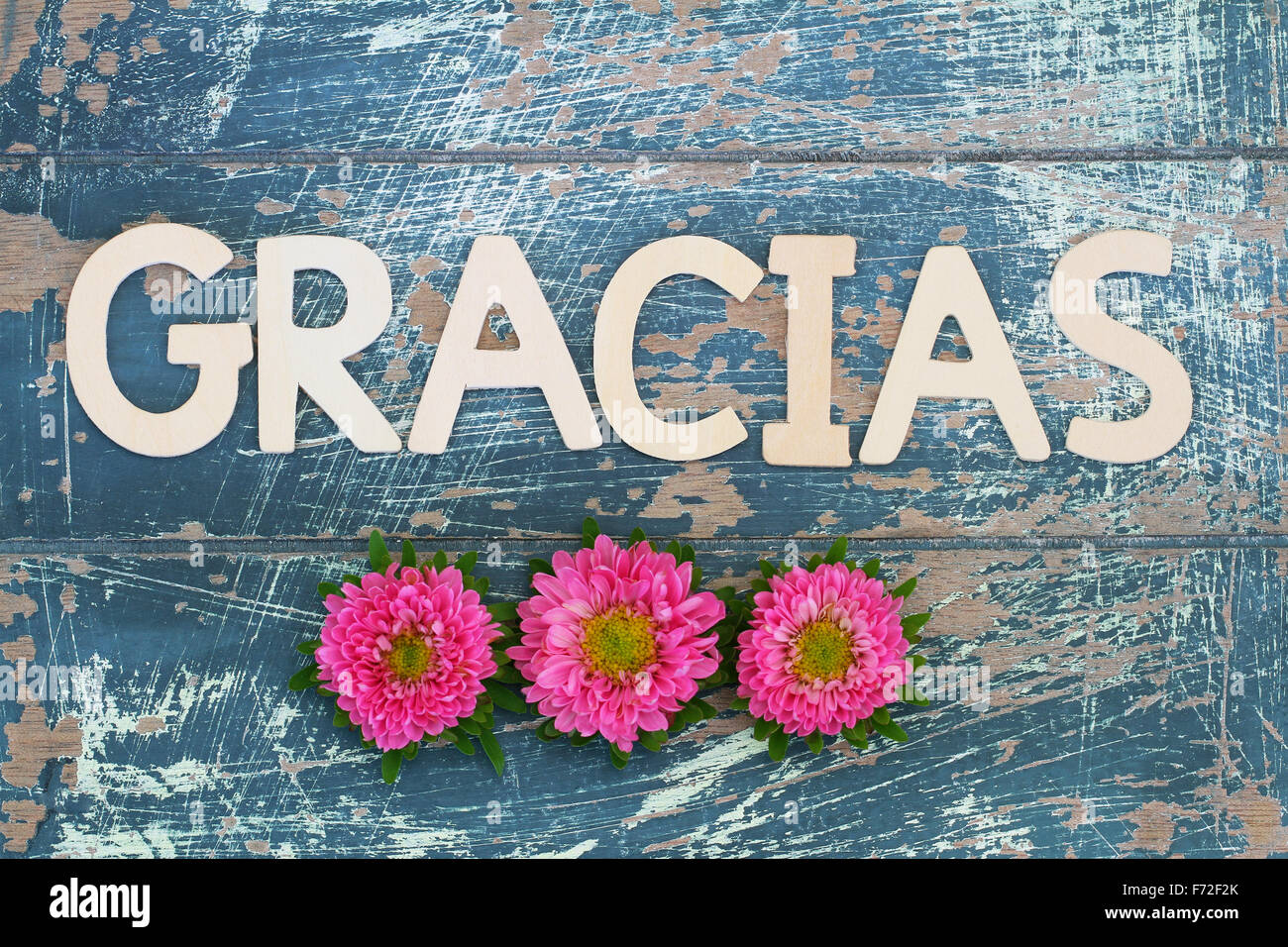 Gracias (thank you in Spanish) written with wooden letters on rustic ...
