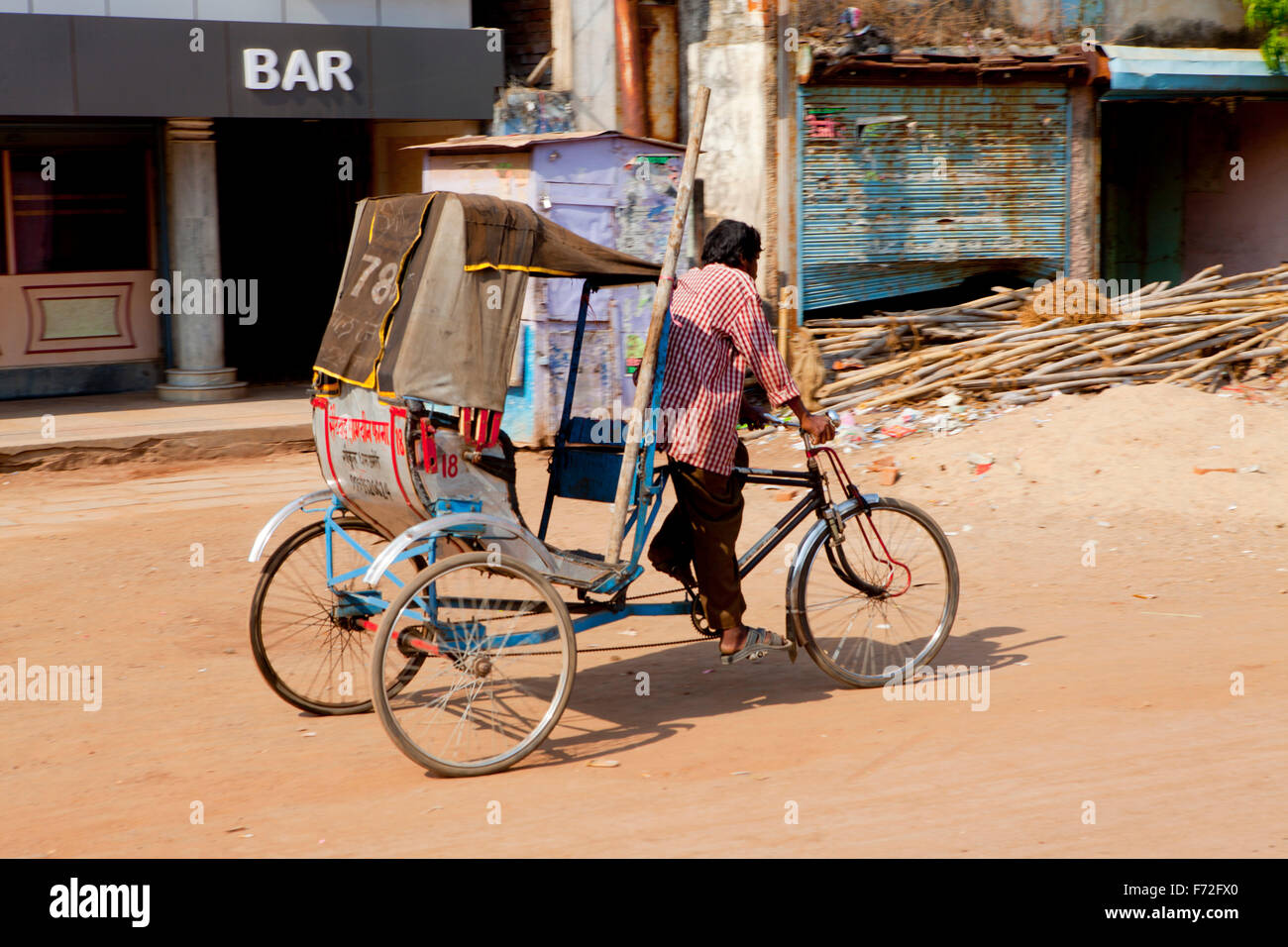 Man riding cycle rickshaw, tricycle rickshaw, Bilaspur, Chhattisgarh ...