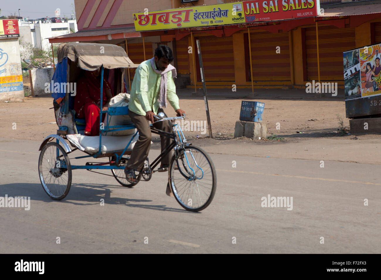 Man riding cycle rickshaw, tricycle rickshaw, Bilaspur, Chhattisgarh ...