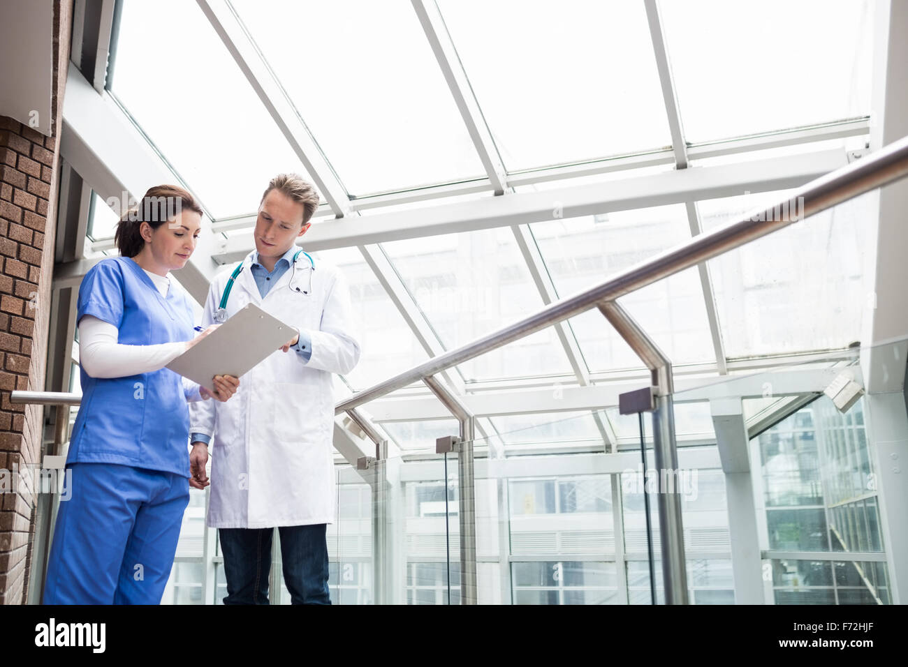 Medical team standing and talking Stock Photo - Alamy