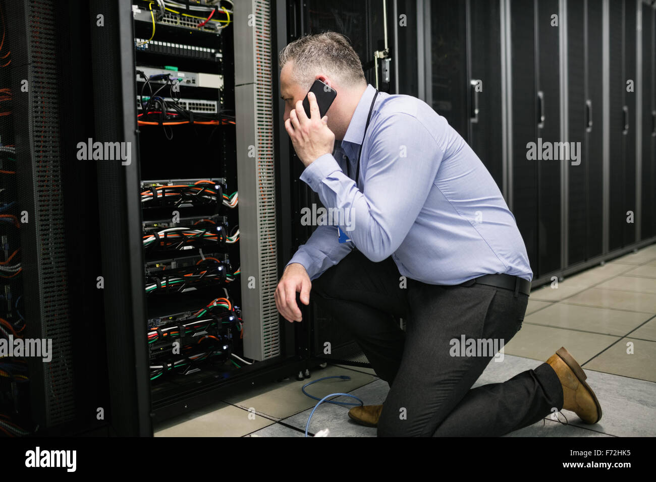 Technician working on broken server Stock Photo - Alamy