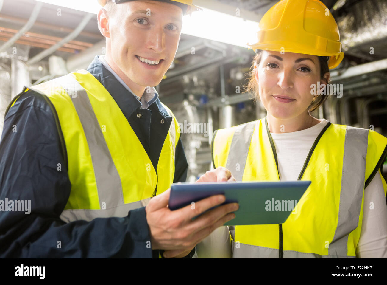 Engineers working in temperature control room Stock Photo - Alamy