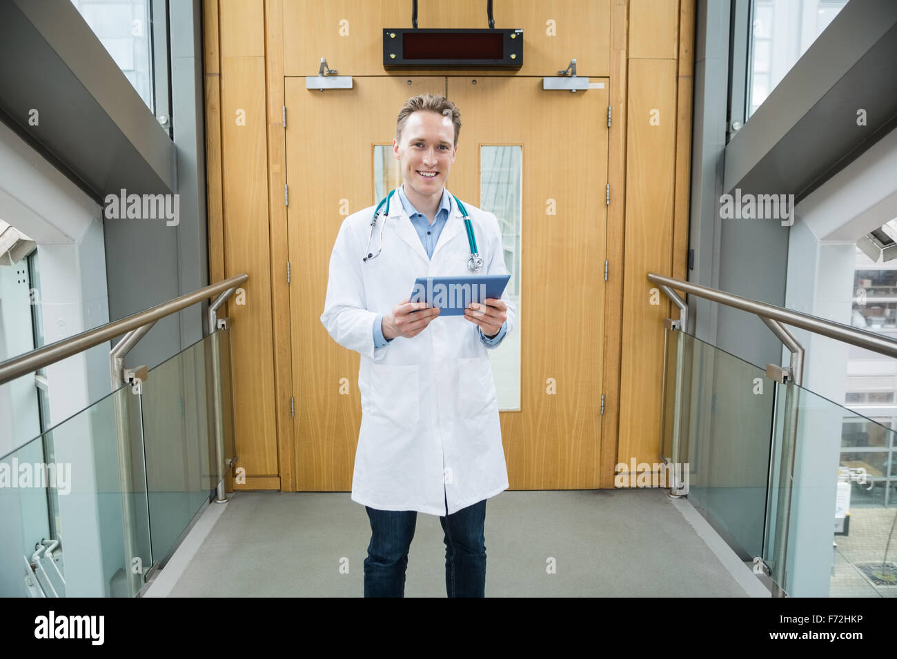 Young doctor smiling at camera Stock Photo - Alamy