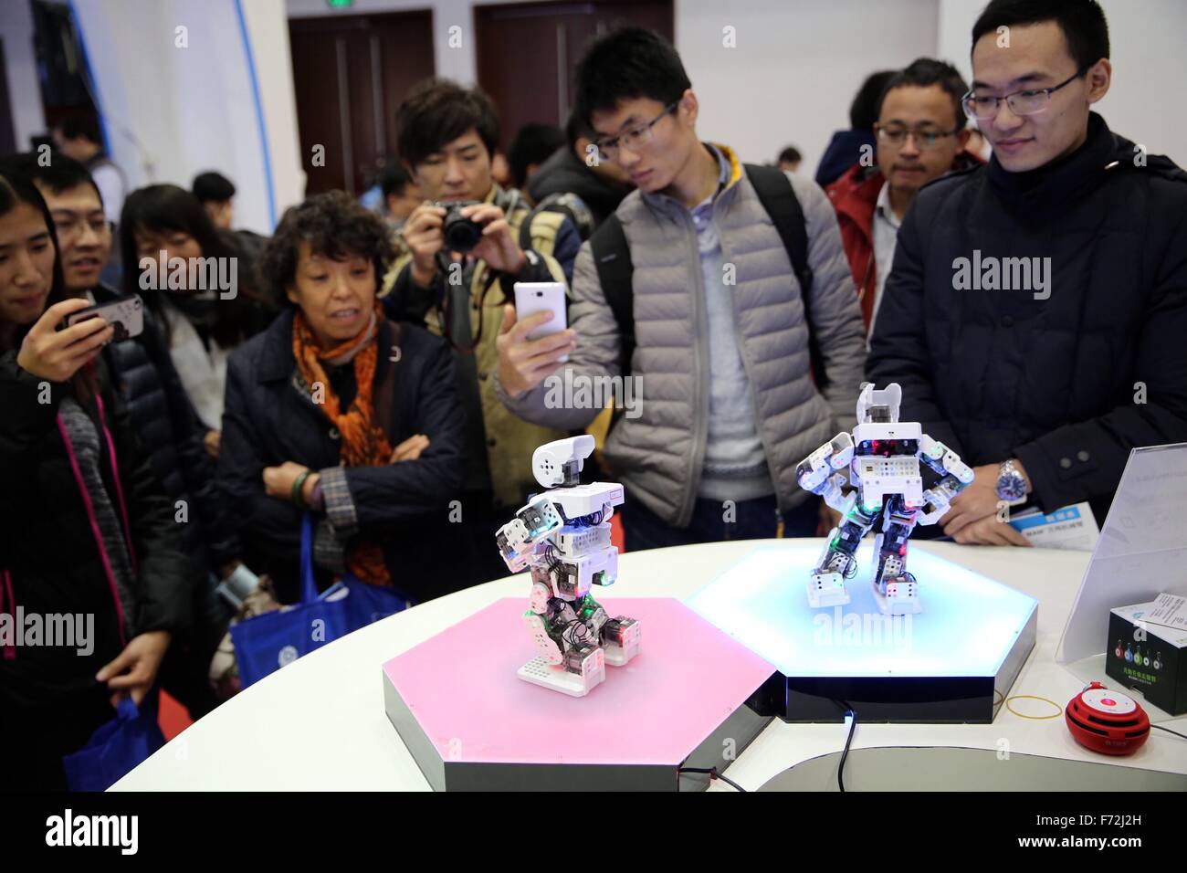 Beijing, China. 24th Nov, 2015. Visitors are attracted by dancing ...