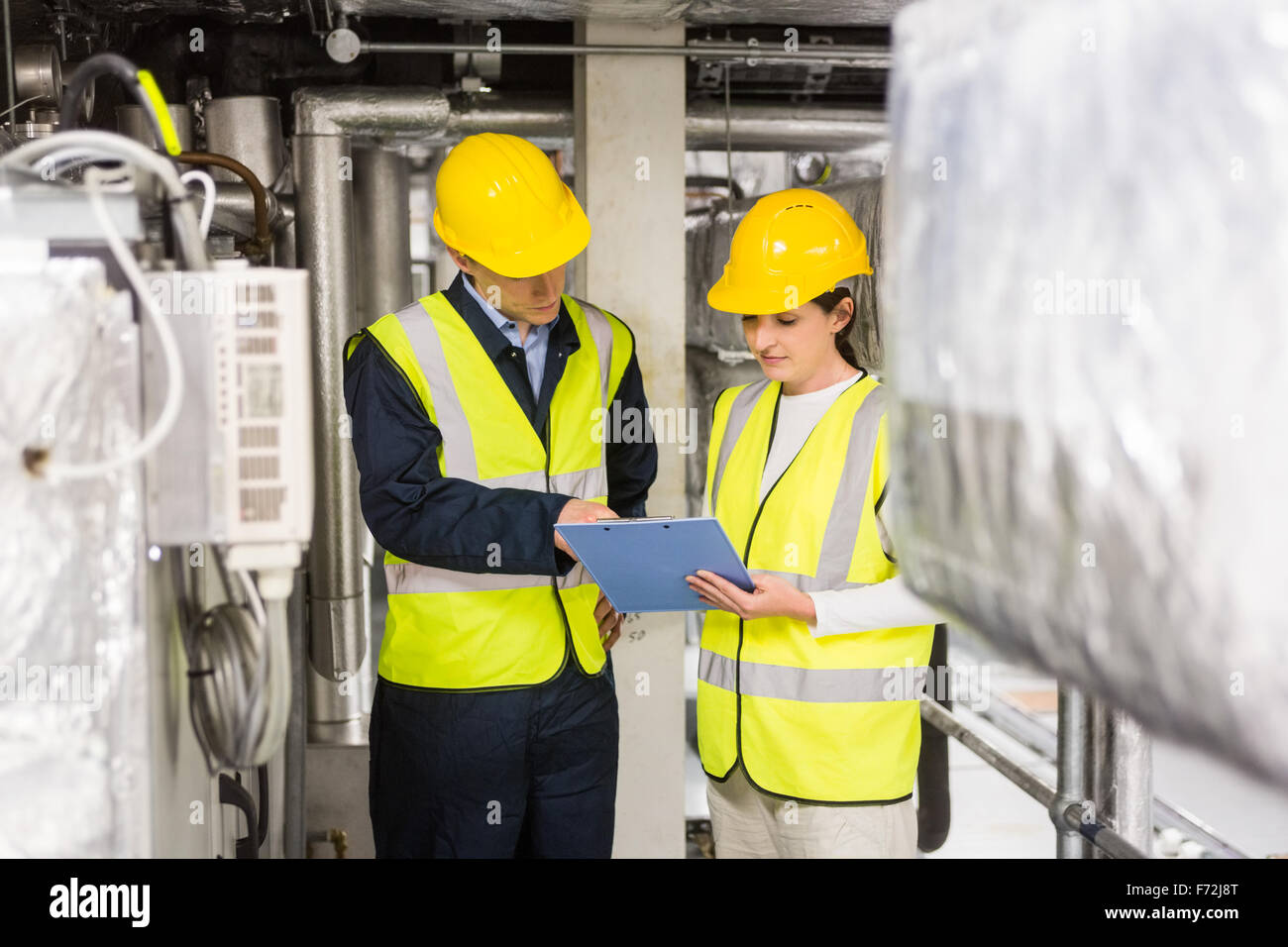 Engineers working in temperature control room Stock Photo - Alamy