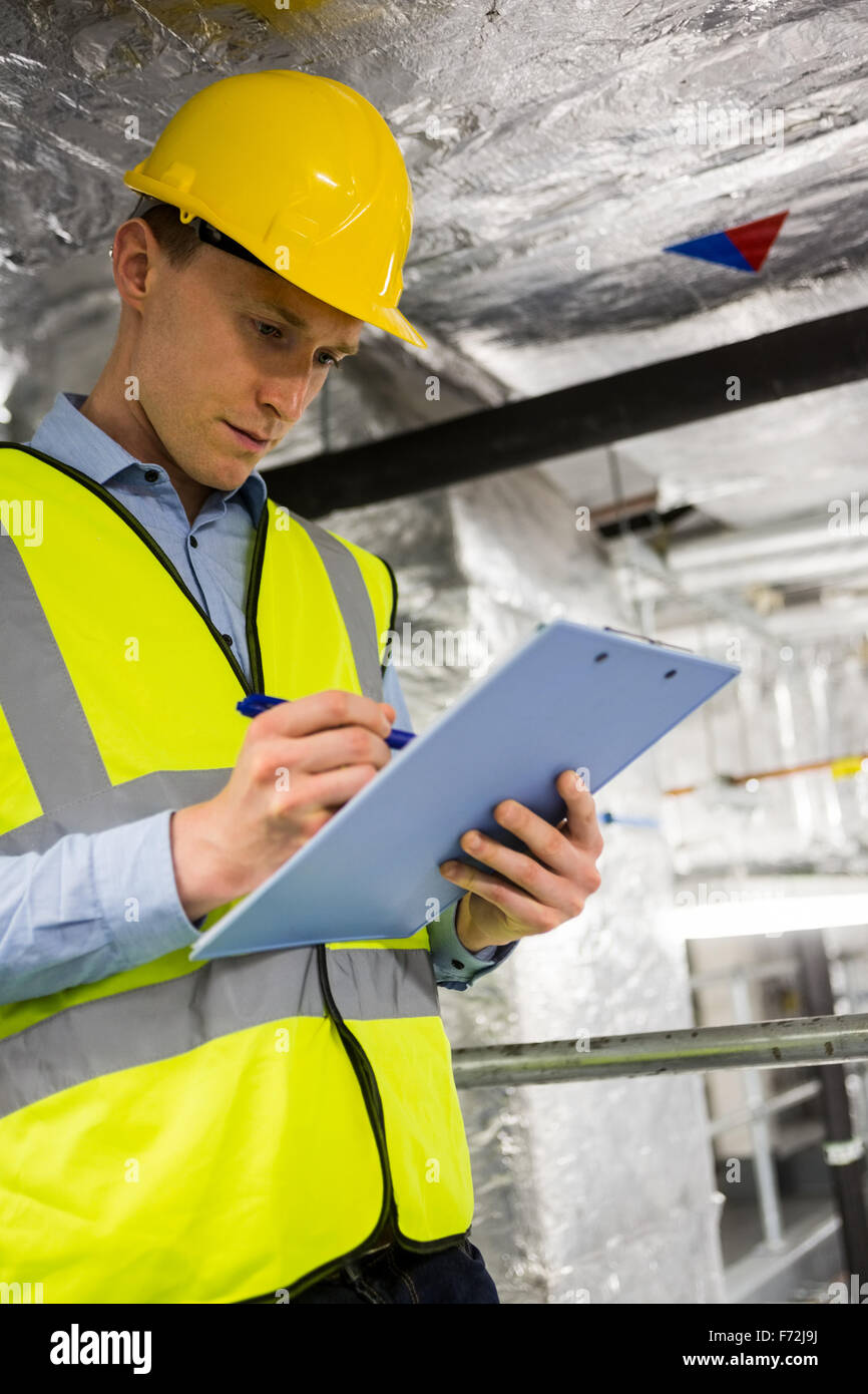Engineer checking the temperature pipes Stock Photo - Alamy