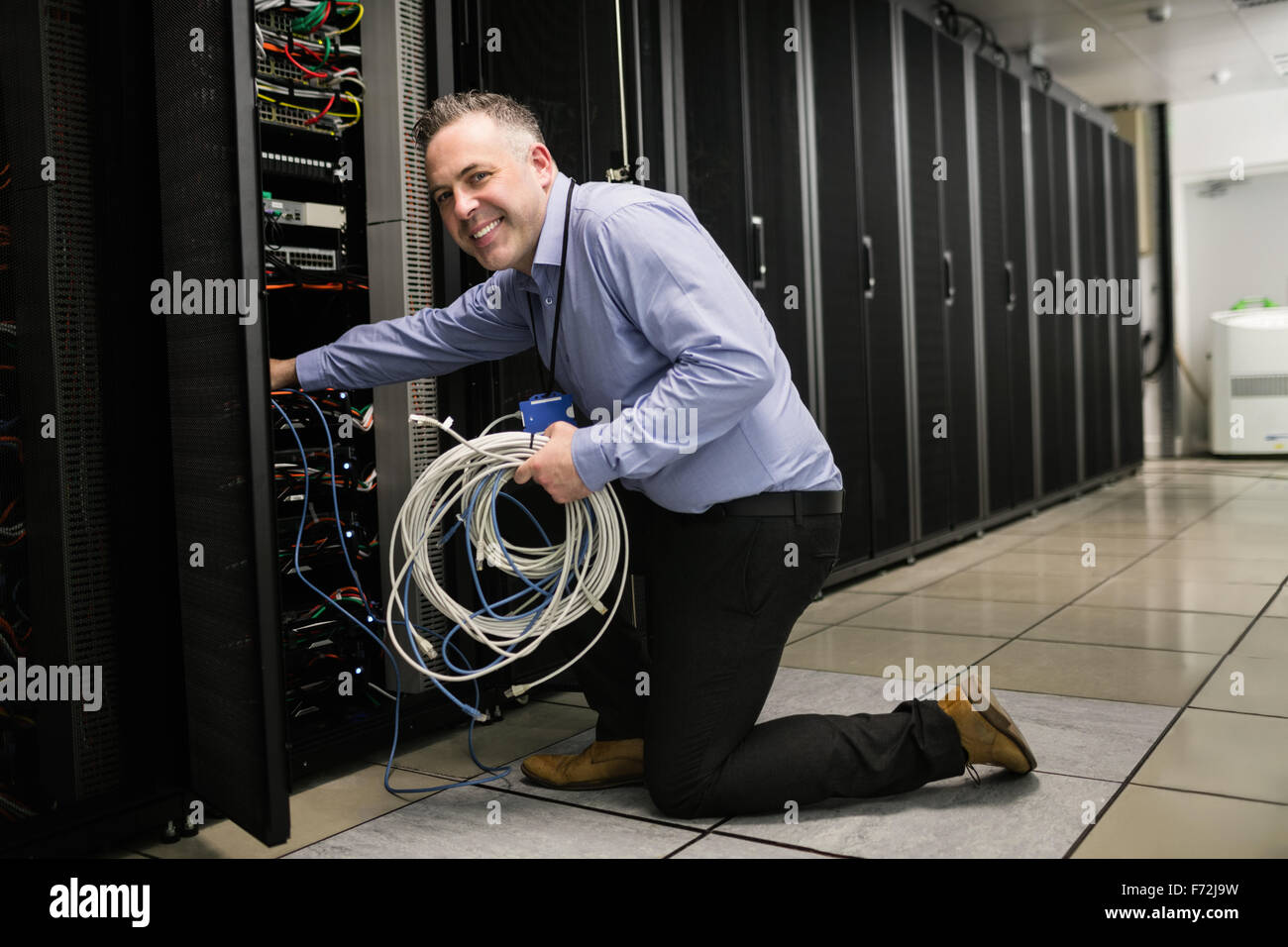 Technician working on broken server Stock Photo - Alamy