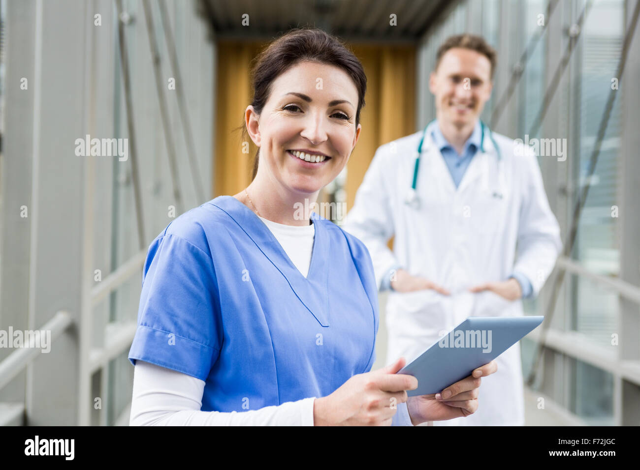 Nurse using her tablet pc Stock Photo - Alamy