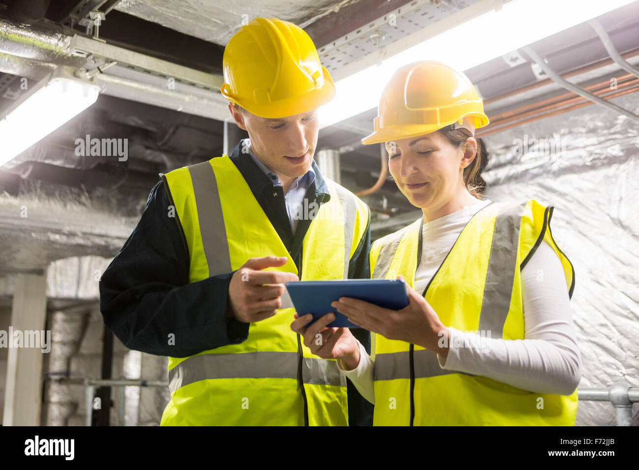 Engineers working in temperature control room Stock Photo - Alamy