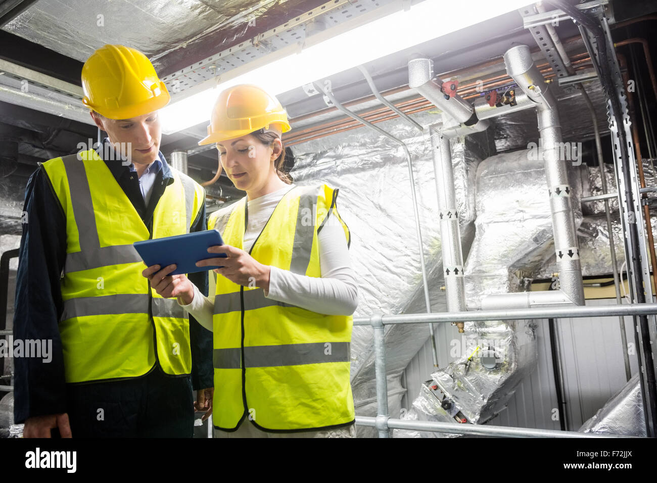 Engineers working in temperature control room Stock Photo - Alamy