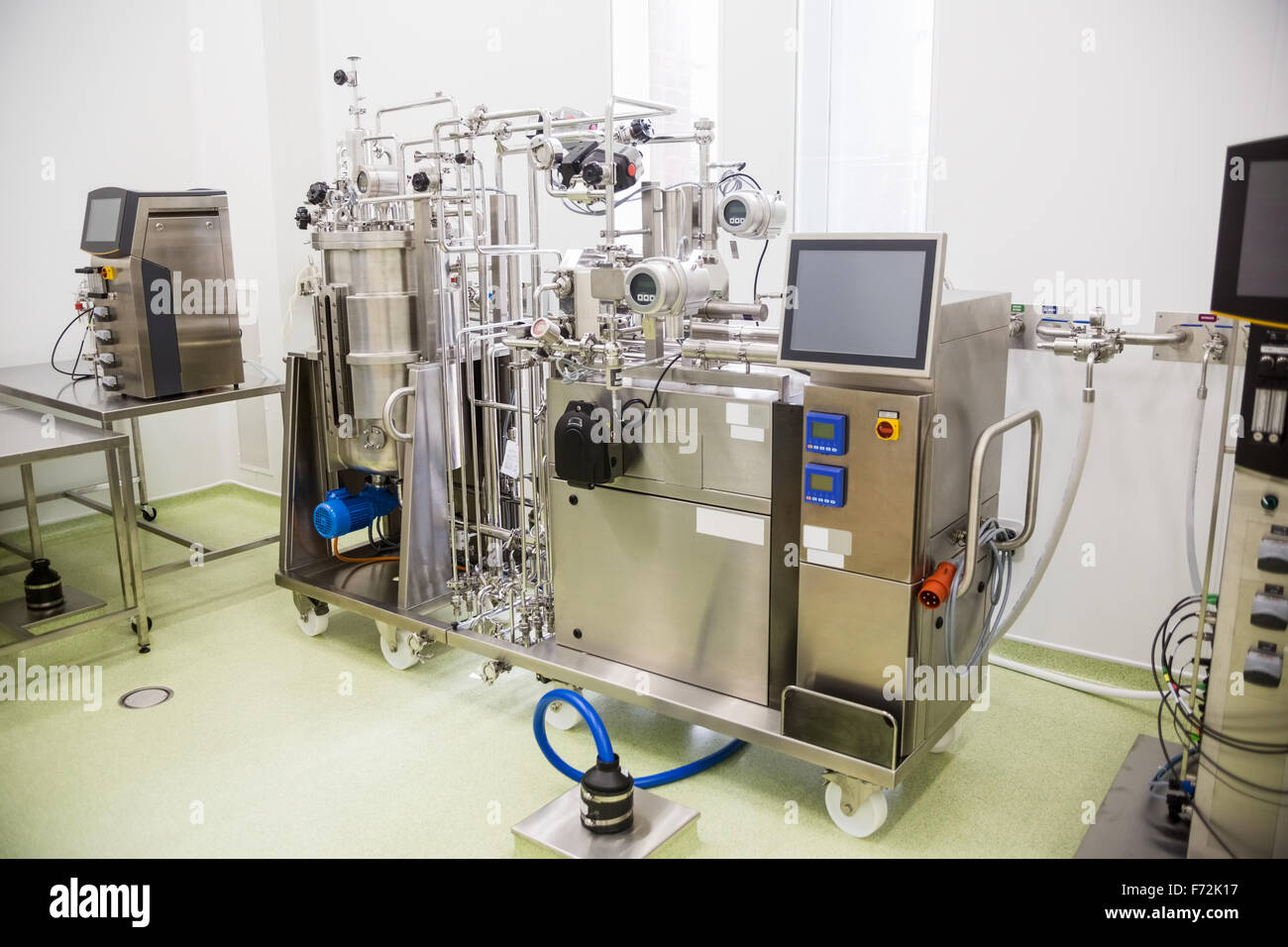 Large vat with taps and pumps Stock Photo - Alamy