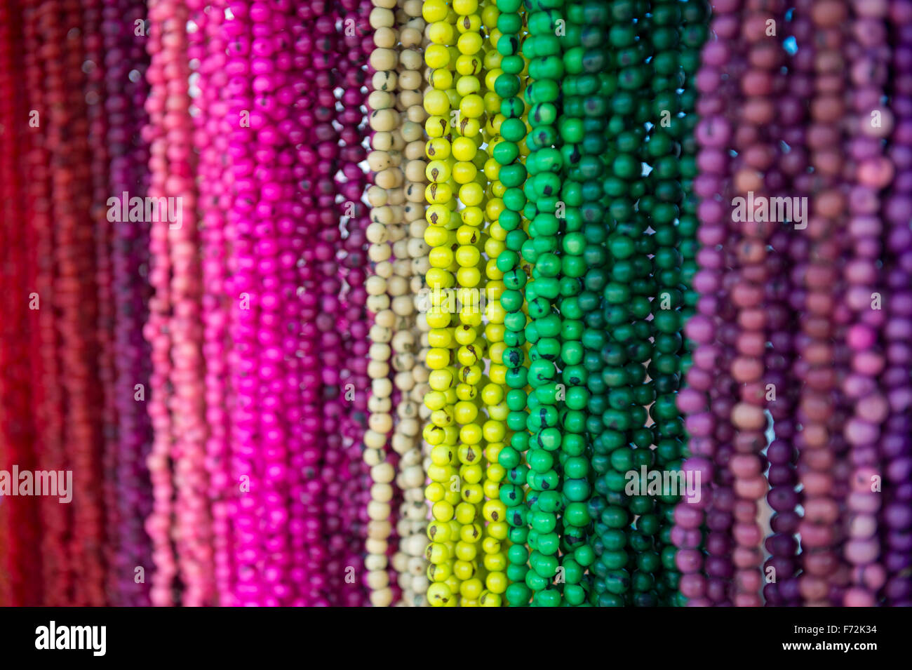 Bright background of handmade strands of colorful beads at outdoor ...