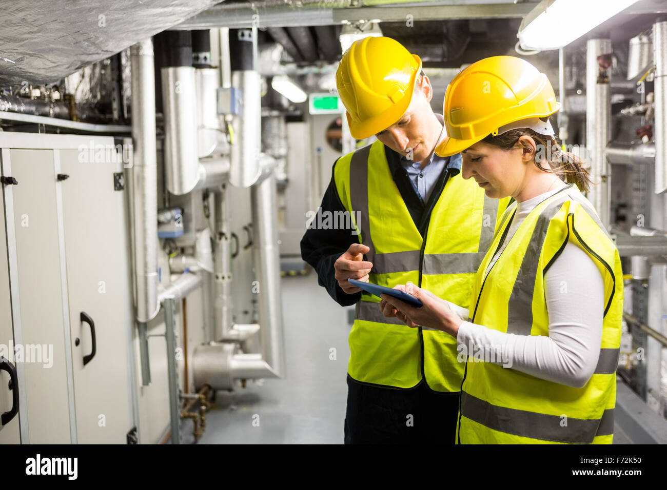 Engineers working in temperature control room Stock Photo - Alamy