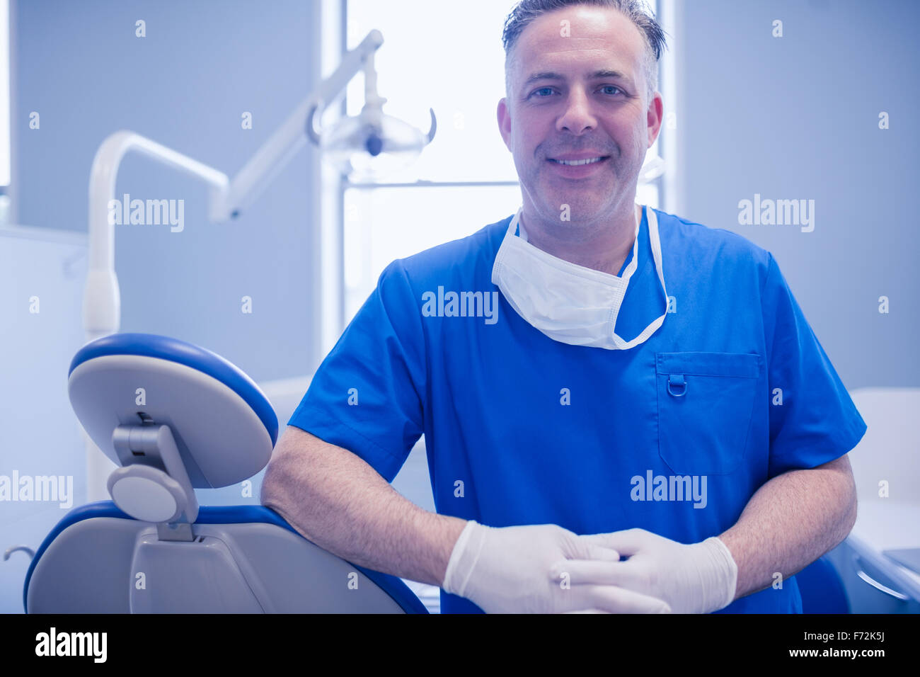 Smiling male dentist in dental clinic Stock Photo - Alamy