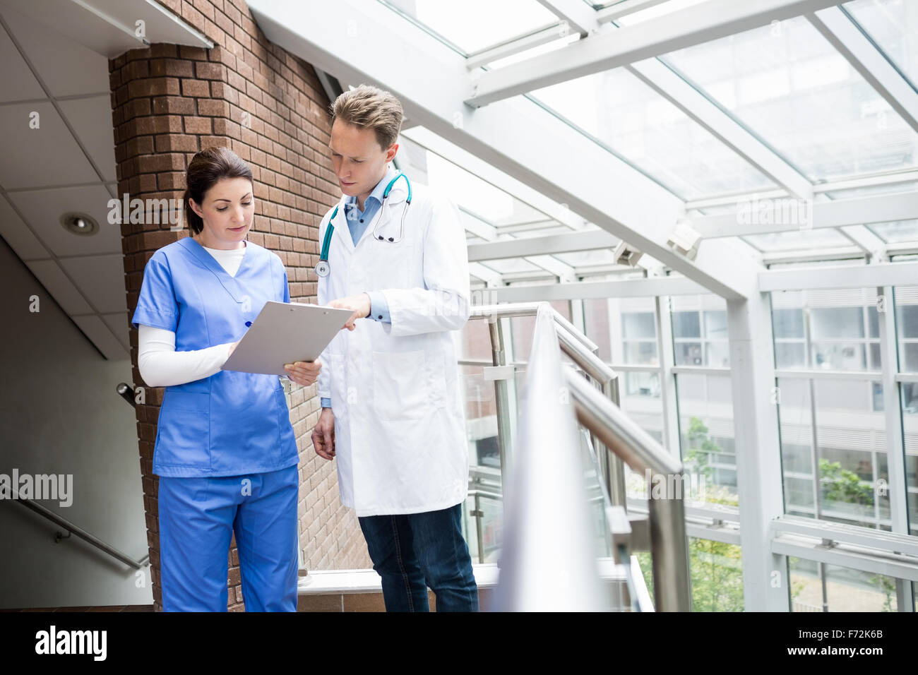 Medical team standing and talking Stock Photo - Alamy