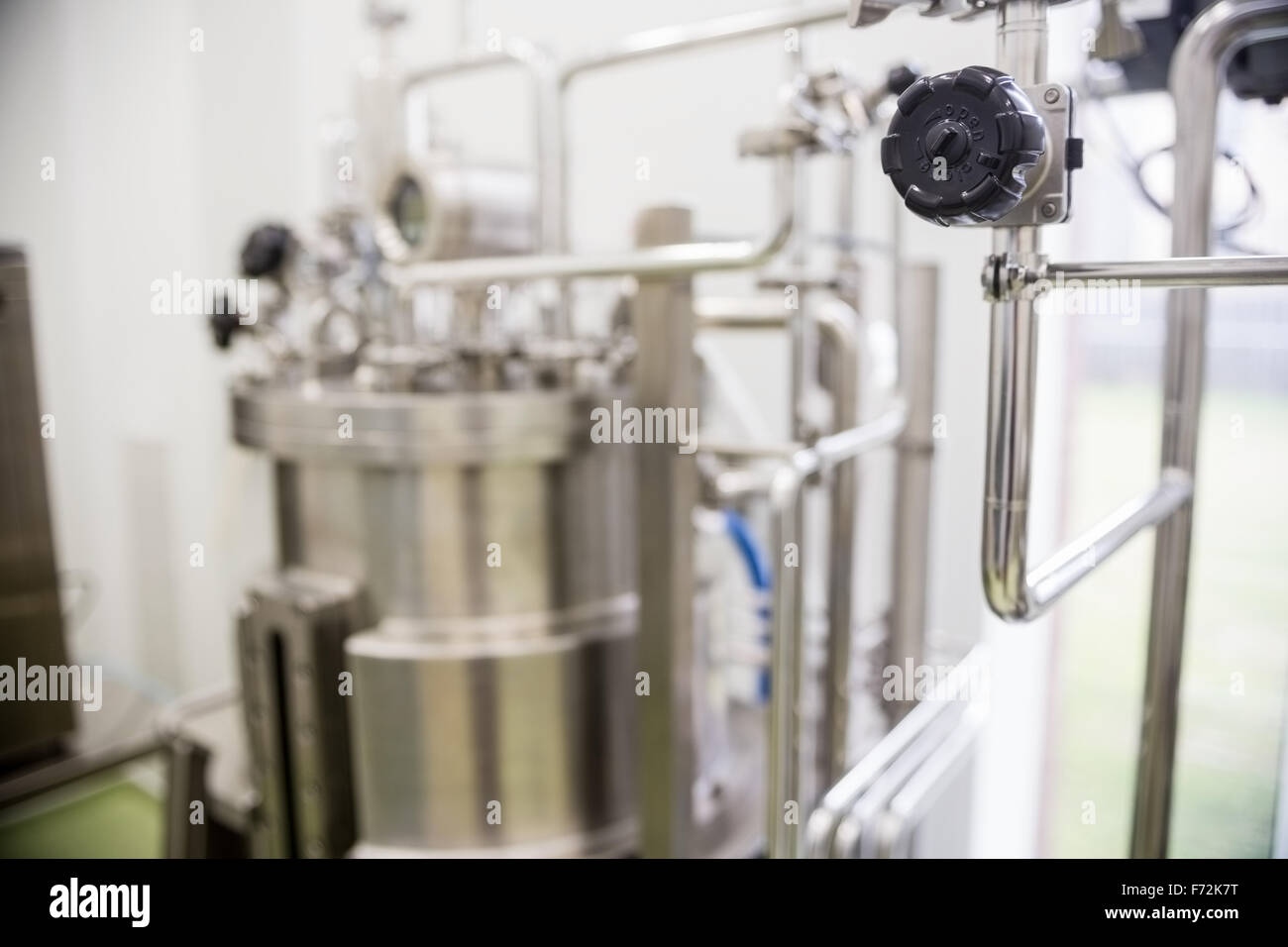 Large vat with taps and pumps Stock Photo - Alamy
