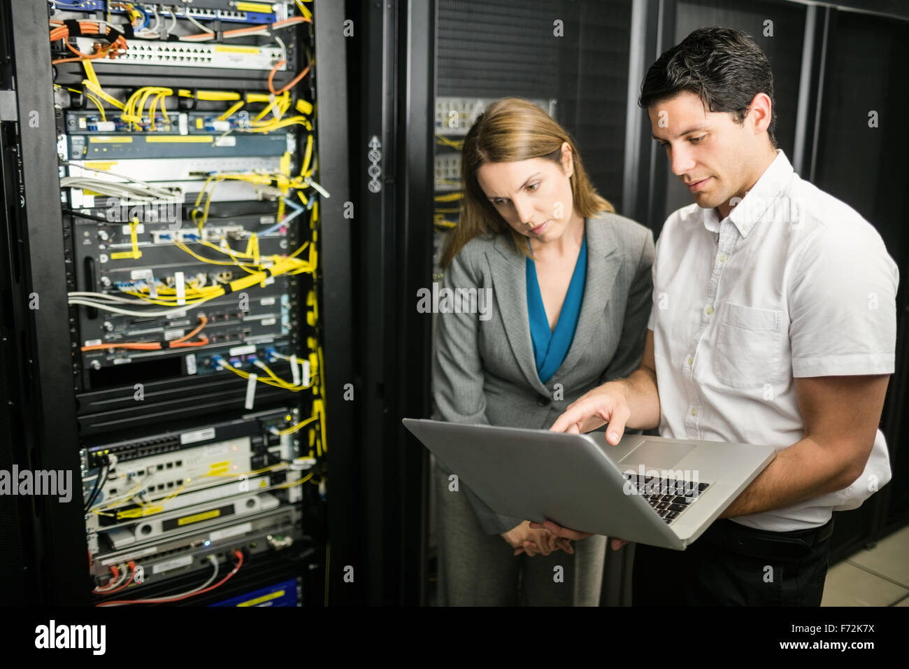 Team of technicians working together Stock Photo - Alamy