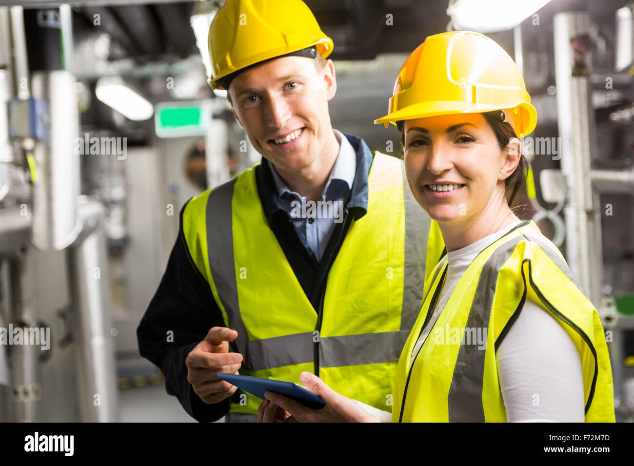 Engineers working in temperature control room Stock Photo - Alamy