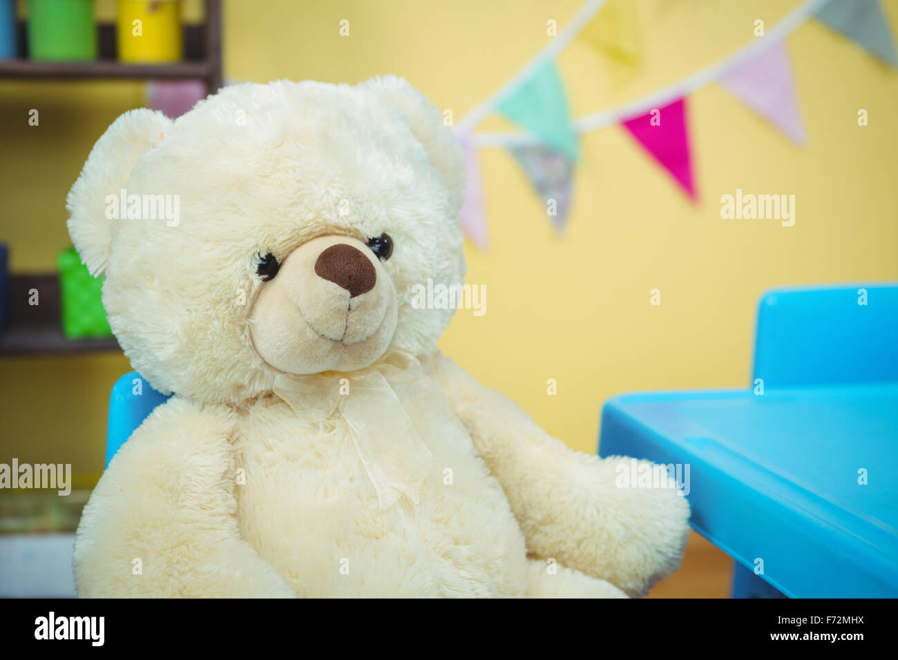 Teddy bear sitting on chair hi-res stock photography and images - Alamy