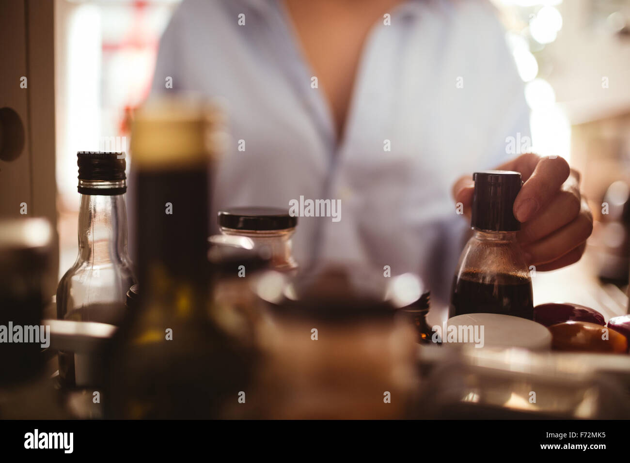 Womans hand picking food Stock Photo - Alamy
