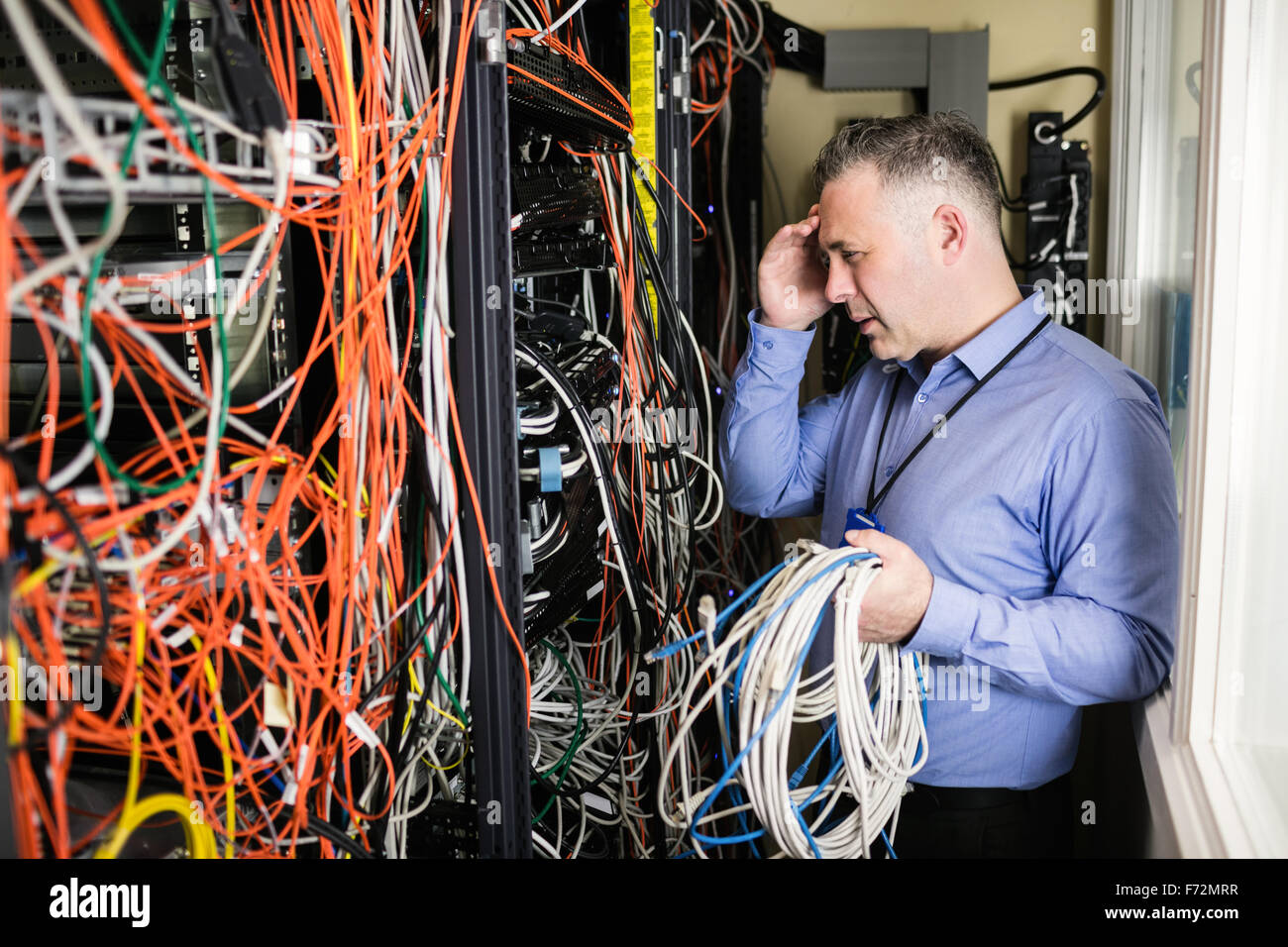 Confused looking computer technician hi-res stock photography and ...